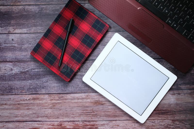 Digital Tablet with Empty Screen, Laptop and Notepad on Desk Stock ...