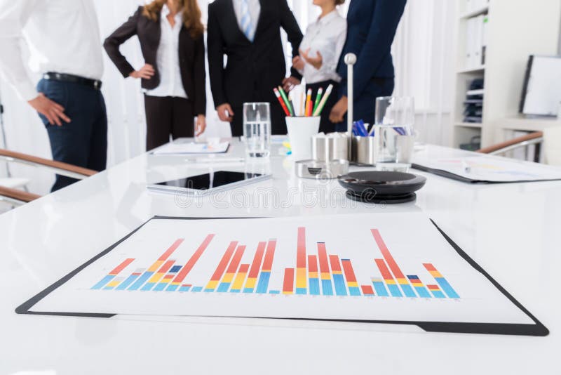 Digital Tablet and Graph on Desk in Office Stock Image - Image of ...