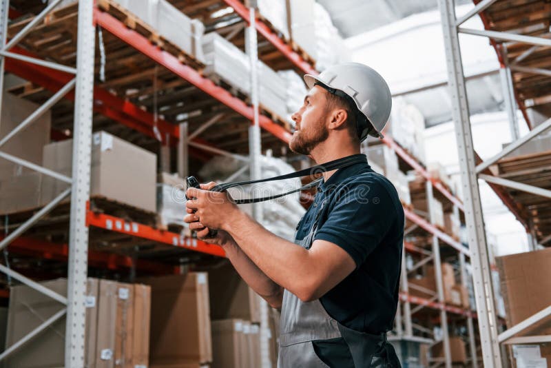 With Digital Tablet in Hands. Employee in Uniform is Working in the ...