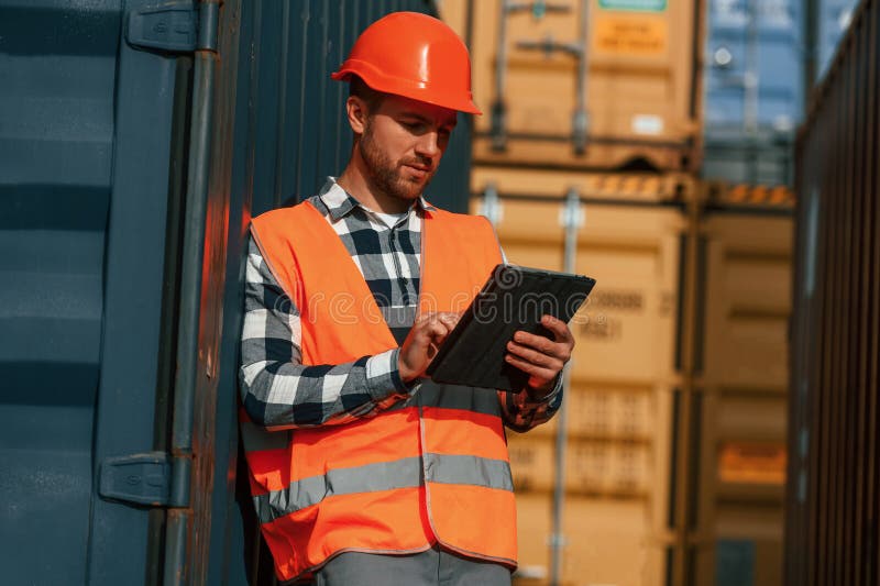 With Digital Tablet in Hands. Male Worker is on the Location with ...