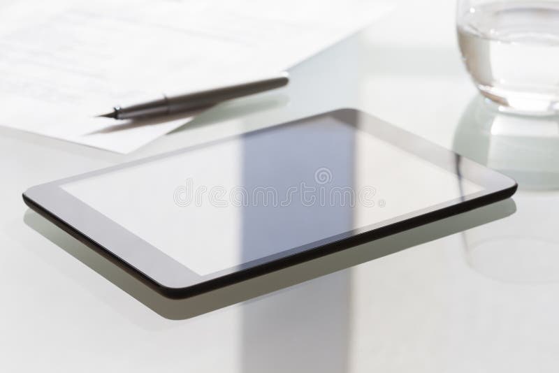 Digital Tablet on Modern Glass Table in Office Stock Photo - Image of ...