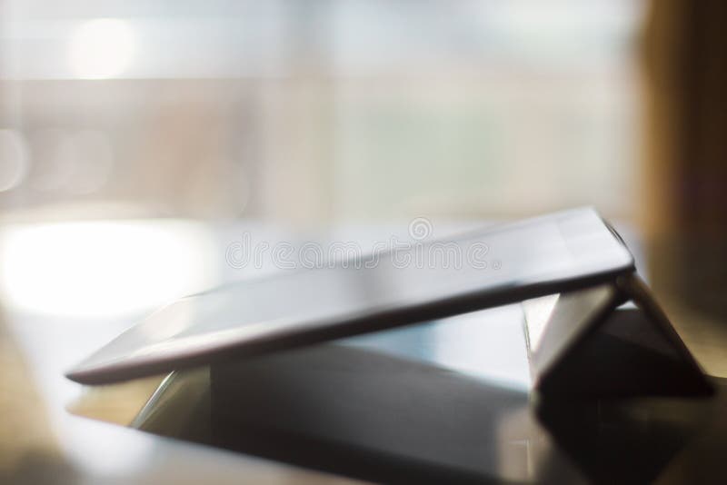 Digital Tablet in a Room at Sunset Stock Photo - Image of communicator ...