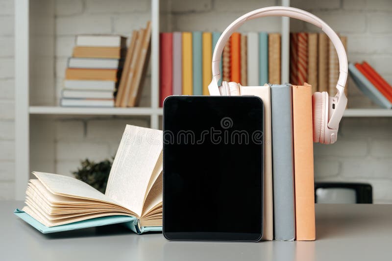 Digital Tablet with Stacked Books in Library Stock Image - Image of ...