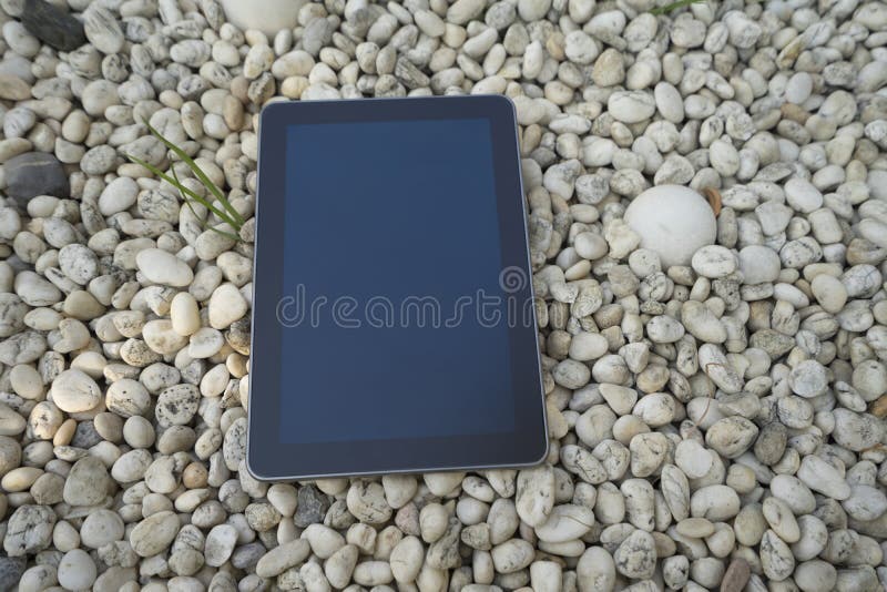 Digital tablet on stone stock image. Image of touch, technology - 71178473