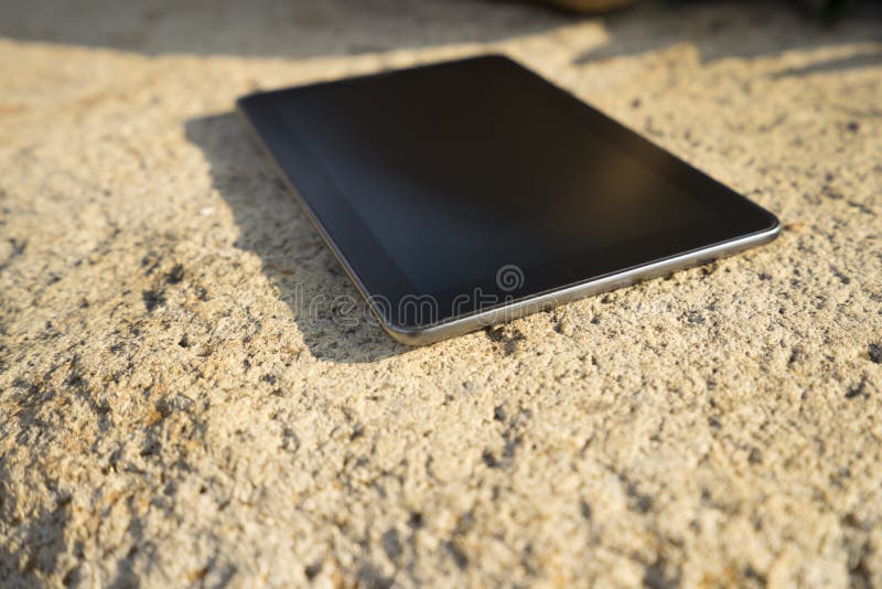 Digital tablet on stone stock image. Image of communication - 71179025