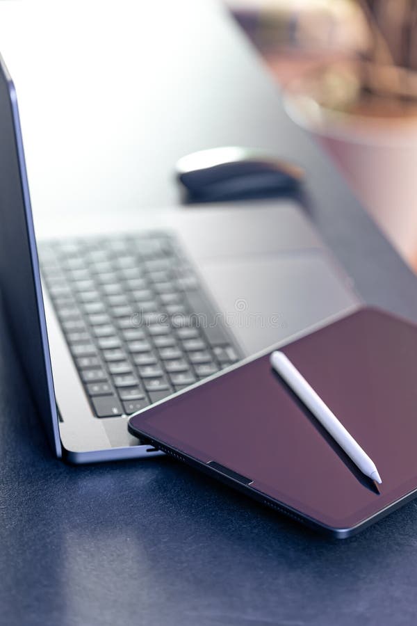 Digital Tablet, Stylus Pen and Laptop on the Desktop, Close Up. Stock ...