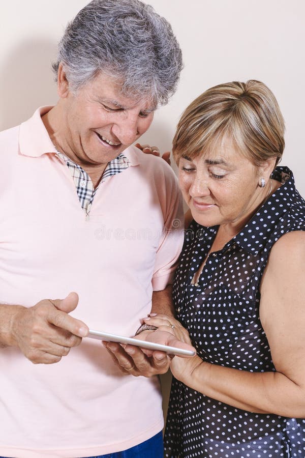 Digital Tablet Use by Couple of Senior People. Stock Image - Image of ...