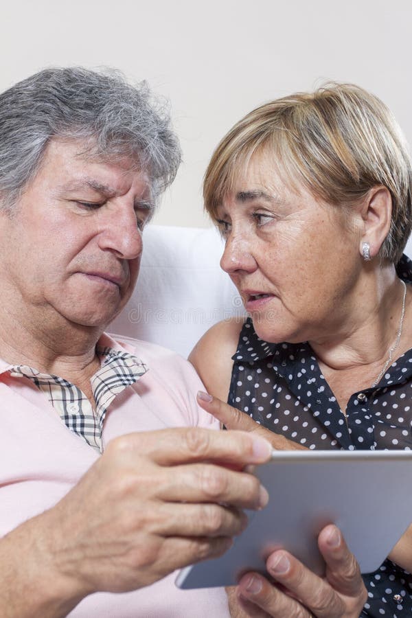 Digital Tablet Use by Couple of Senior People. Stock Photo - Image of ...
