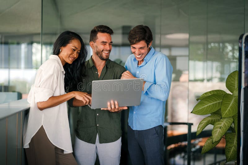 Software Engineers Using Laptop Computer with Global Network Connection ...