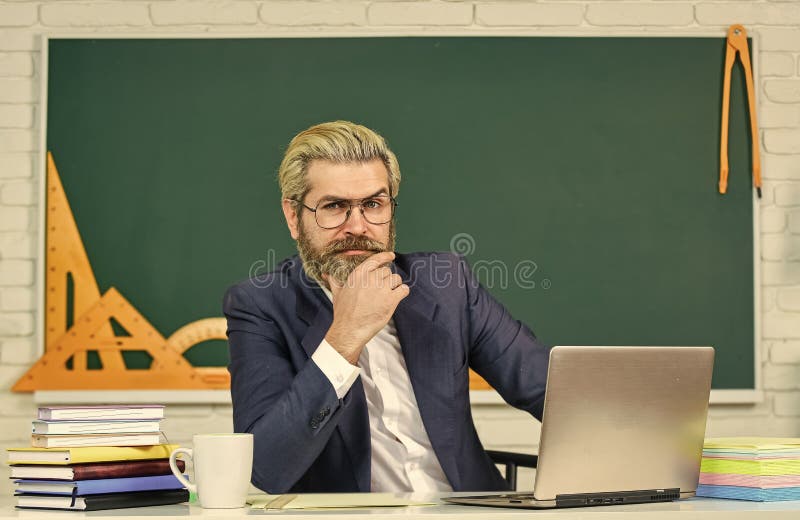 Digital Technology Enhances Education. Senior Teacher Use Laptop in ...