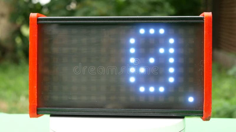 A Digital Timer Counts Down the Digits To Zero on a Rotating Stand ...