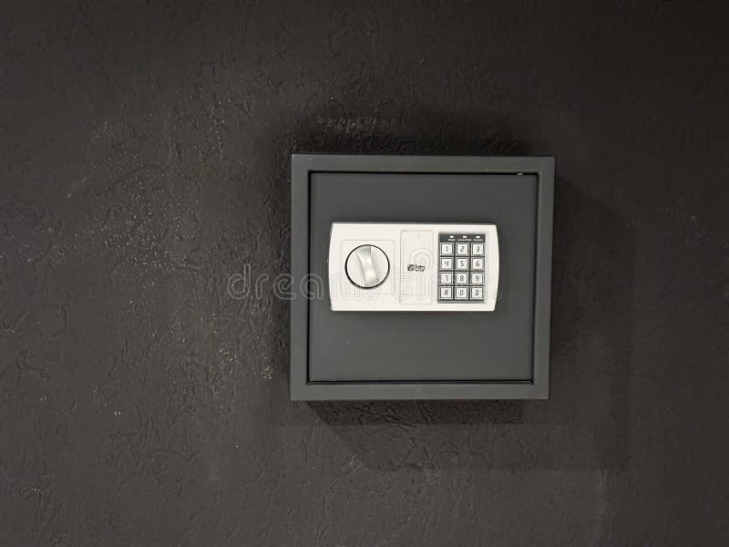 Digital Wall Safe with Keypad and Dial on Black Textured Wall Editorial ...