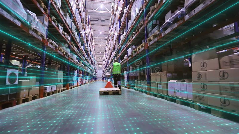 Digitalization of Production. a Worker is Carrying a Rokla through a ...