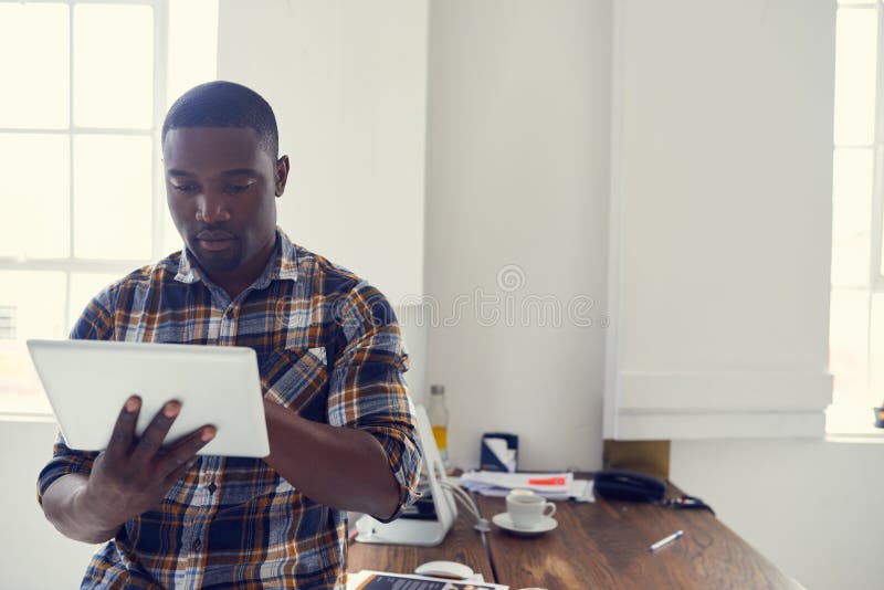Digitizing His daily Work Tasks. a Young Businessman Using a Digital ...