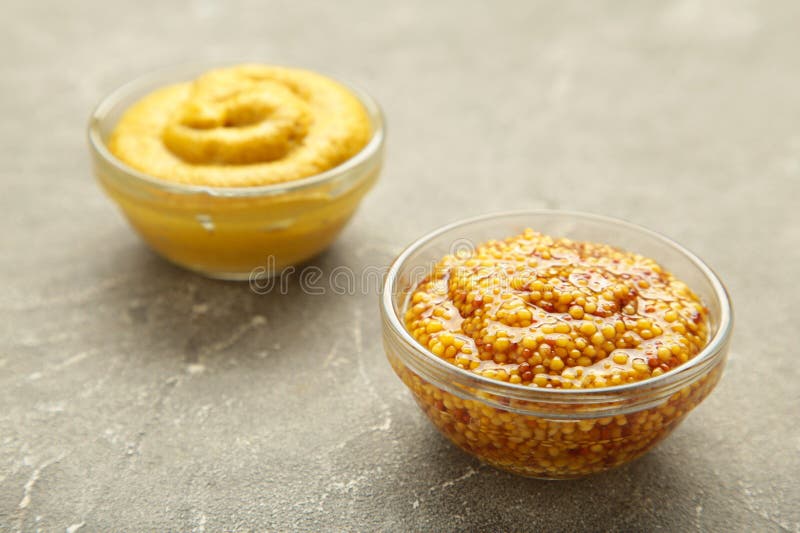 Dijon Mustard with French Mustard on Grey Concrete Background Stock ...