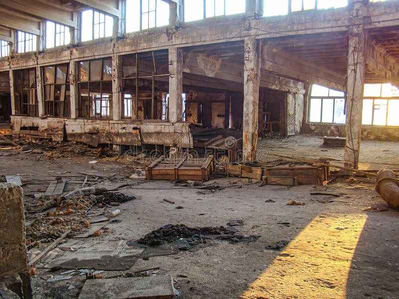 A Dilapidated Building with Damaged Walls, Ceilings, and Rusted ...