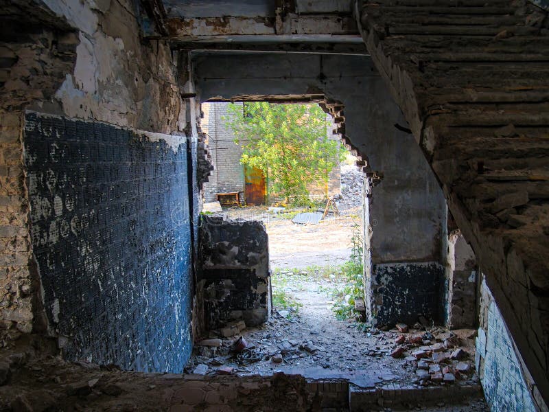 Dilapidated Building Interior with Missing Walls, Broken Windows, and ...