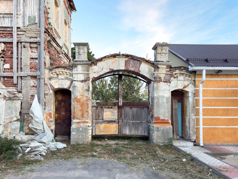 The Dilapidated Gate of the House Made of White Timber Was Closed To ...