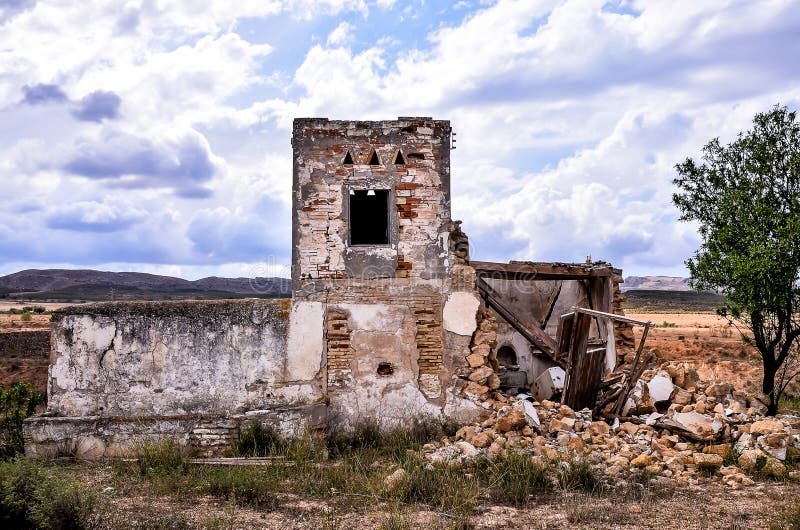 A Dilapidated Building with a Window and a Tree in the Background Stock ...