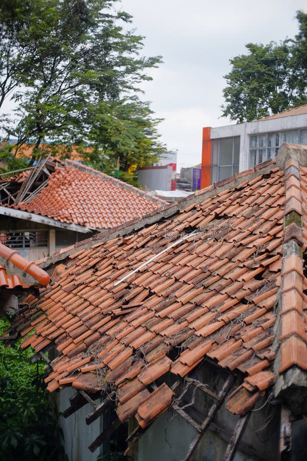 Dilapidated Clay Tiled Rooftops Reveal Weather Damage and Structural ...