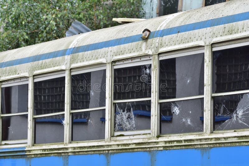Dilapidated and Rusty Bus with Broken Windows in a Remote Area. Scrap ...