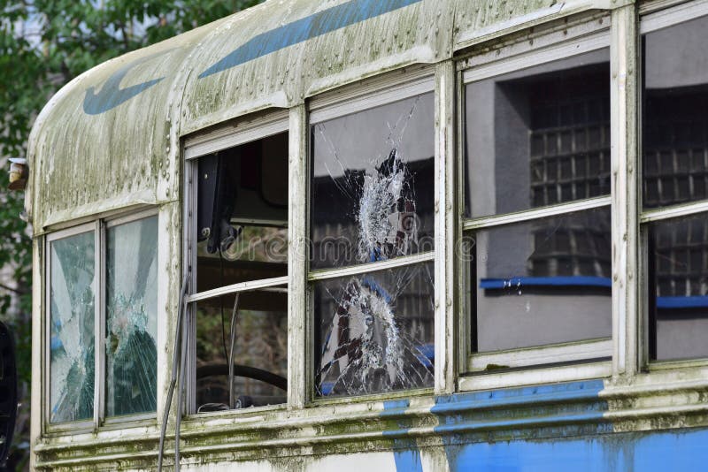 Dilapidated and Rusty Bus with Broken Windows in a Remote Area. Scrap ...