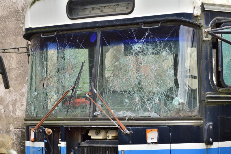 Dilapidated and Rusty Bus with Broken Windows in a Remote Area. Scrap ...