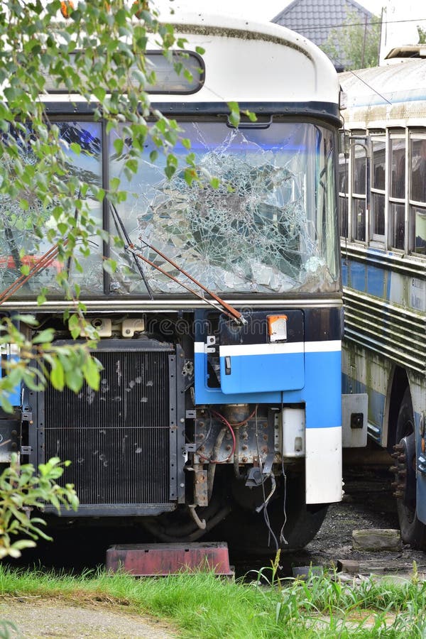 Dilapidated and Rusty Bus with Broken Windows in a Remote Area. Scrap ...