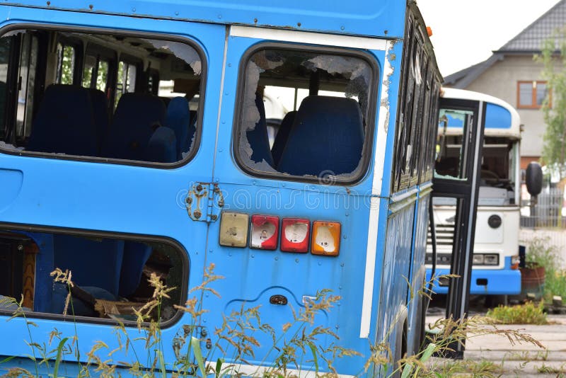 Dilapidated and Rusty Bus with Broken Windows in a Remote Area. Scrap ...