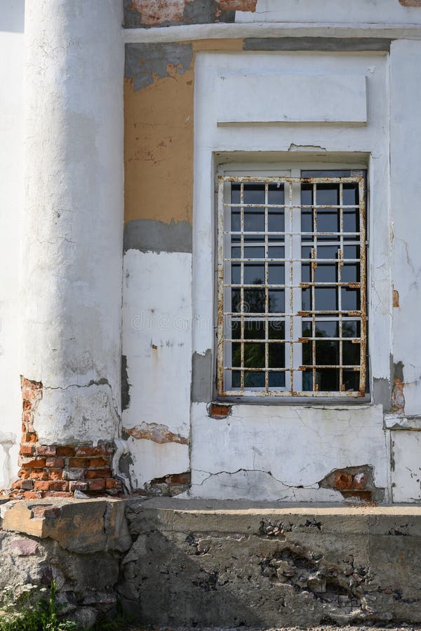 A Dilapidated Wall with a Window and a Column of a Medieval Church ...