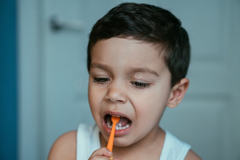 Cute, Diligent Boy Brushing Teeth in Stock Photo - Image of toothpaste ...