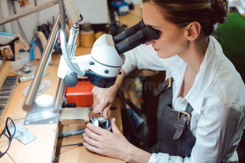 Diligent Jeweler Working on Microscope at Her Workbench Stock Image ...