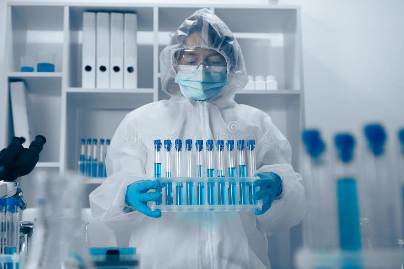 A Diligent Laboratory Researcher is Expertly Handling Test Tubes while ...