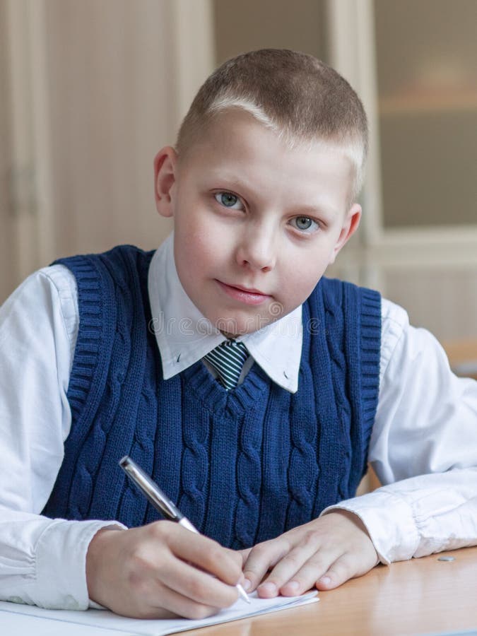 Diligent Student Sitting at Desk, Classroom Stock Image - Image of ...