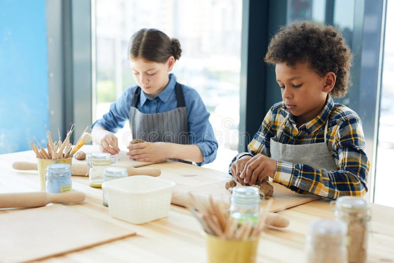 Kneading clay stock image. Image of elementary, girl - 119076367