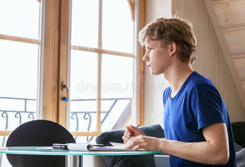 Diligent Student Immersed in Latenight Library Sessions, Surrounded by ...