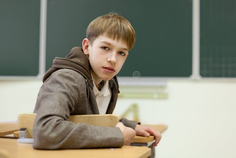 Diligent Student Sitting at Desk, Classroom Stock Photo - Image of male ...