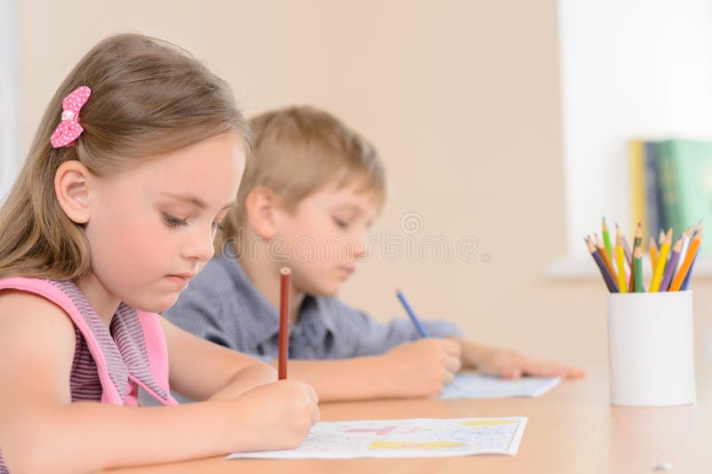 Diligent young learners. stock photo. Image of elementary - 32879844