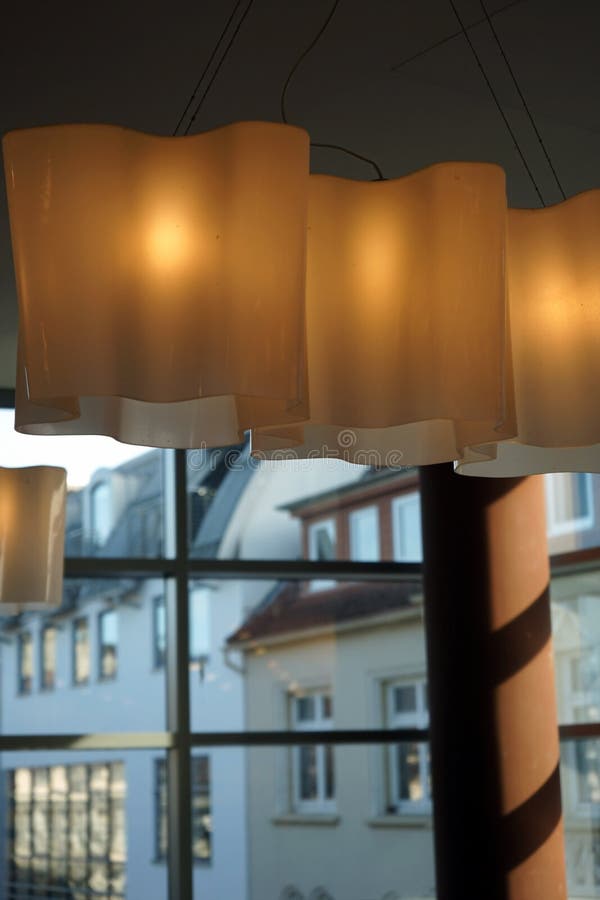 Dim Light in a Cafe Against a Glass Window Stock Image - Image of ...