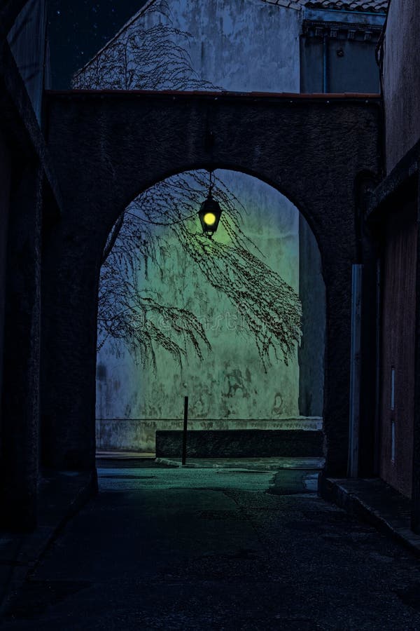 Dim Light from a Street Lamp in the Arch of a Street in Carcassonne ...