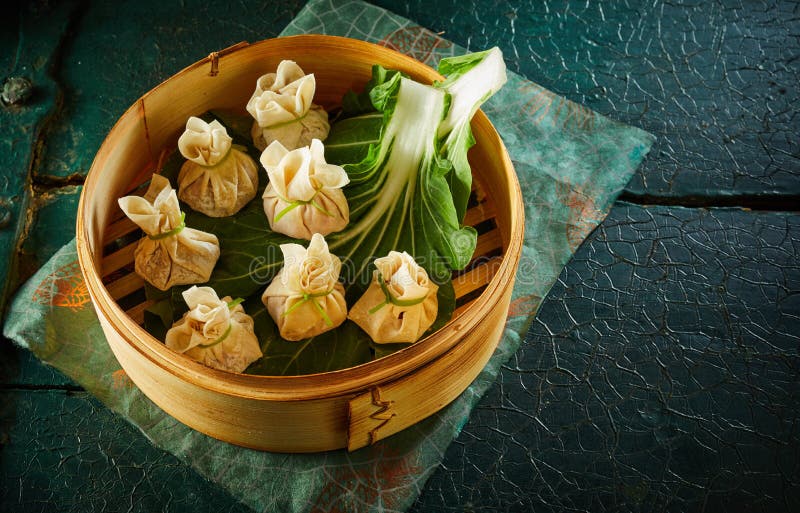 Dim Sum Dumplings on Green Leaf in Bamboo Basket Stock Photo - Image of ...