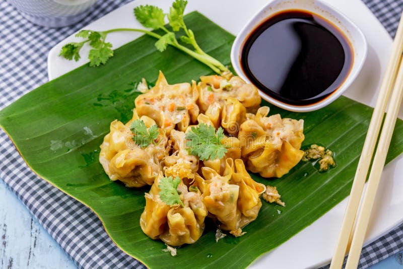 Dim sum on white plate stock image. Image of steamer - 184614165