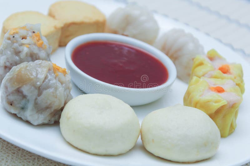 Dim sum in white plate stock image. Image of basket, delicious - 76930507