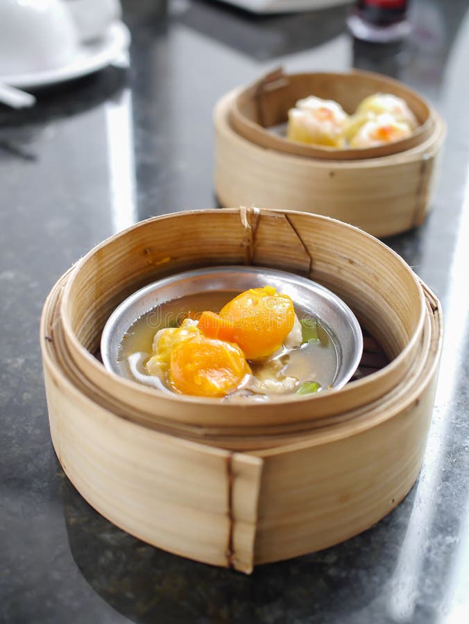 Dim Sum, York Egg on Pork Dumpling in the Basket Stock Photo - Image of ...