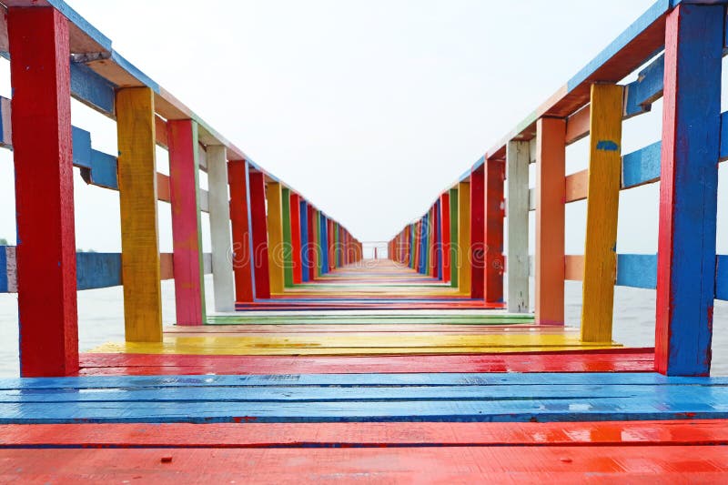 Diminishing Perspective of a Rainbow Colored Pier Bridge Stock Photo ...