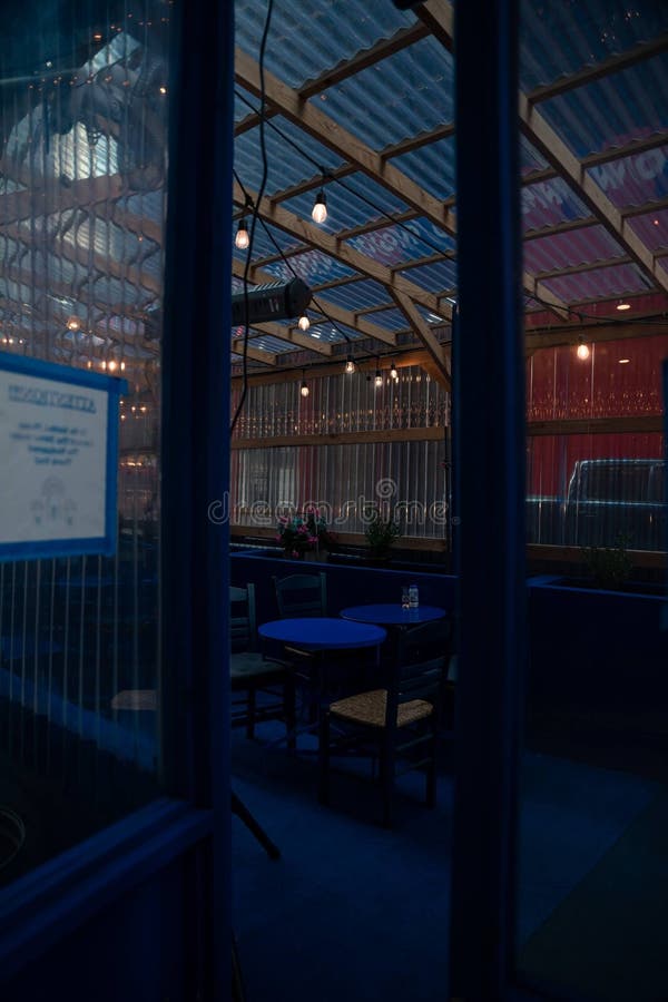 Dimly Lit Cafe with Blue Interior with No Customers Inside Stock Image ...