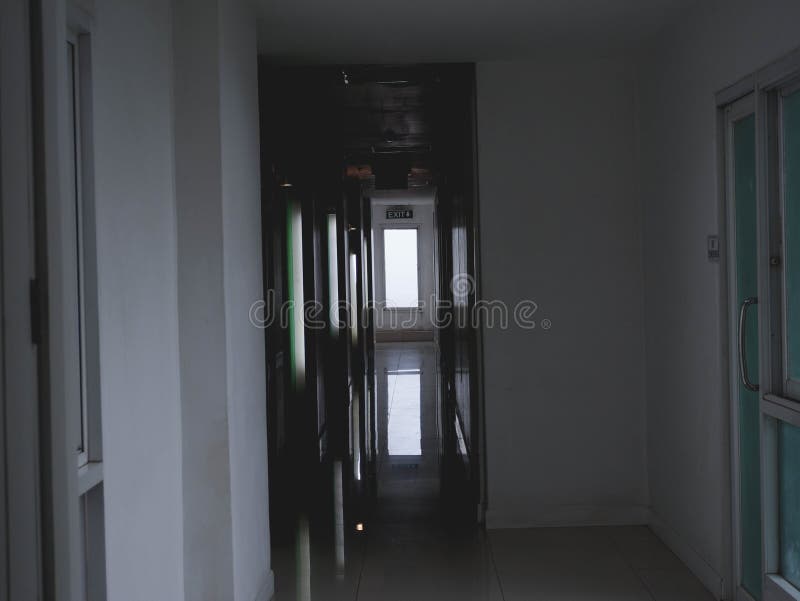 Dimly Lit Corridor Inside the Hotel To Enter the Rooms, with Light ...