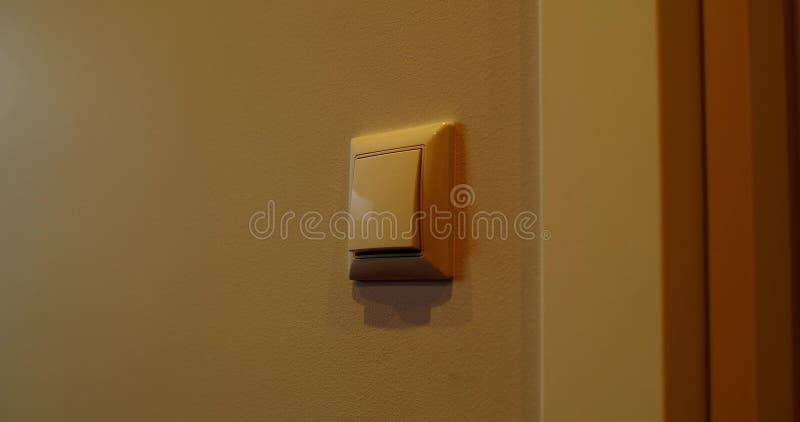 A Dimly Lit Light Switch Set Against a Deep, Dark Wall Creates an ...