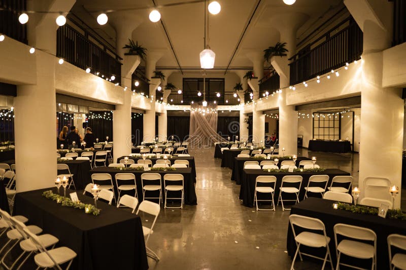 Dimly Lit Room of Evening Wedding Reception with Candles and String ...