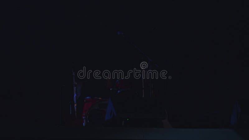 Dimly Lit Stage with Drum Set and Microphone Stock Footage - Video of ...